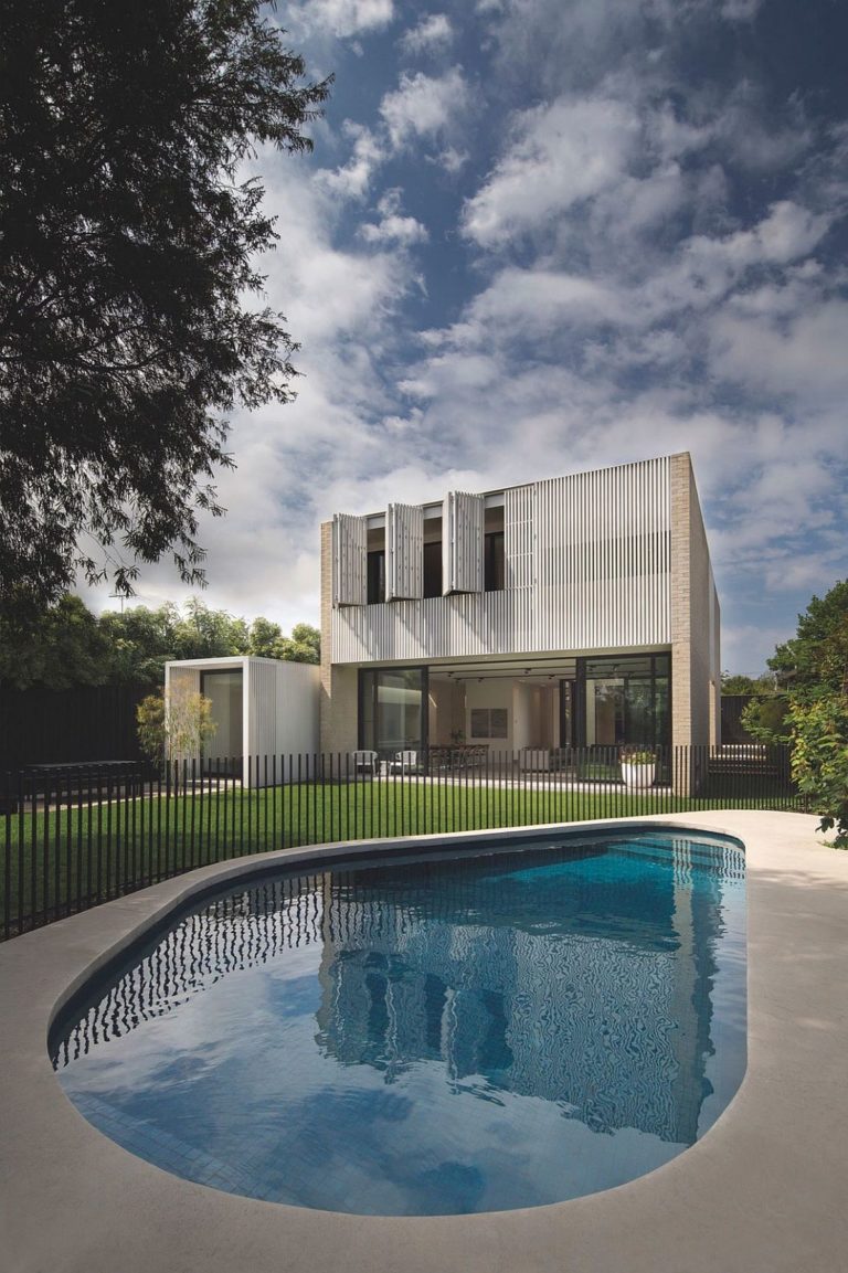 Hiding House: Confluence of Concrete, Timber and White Stained Cladding ...