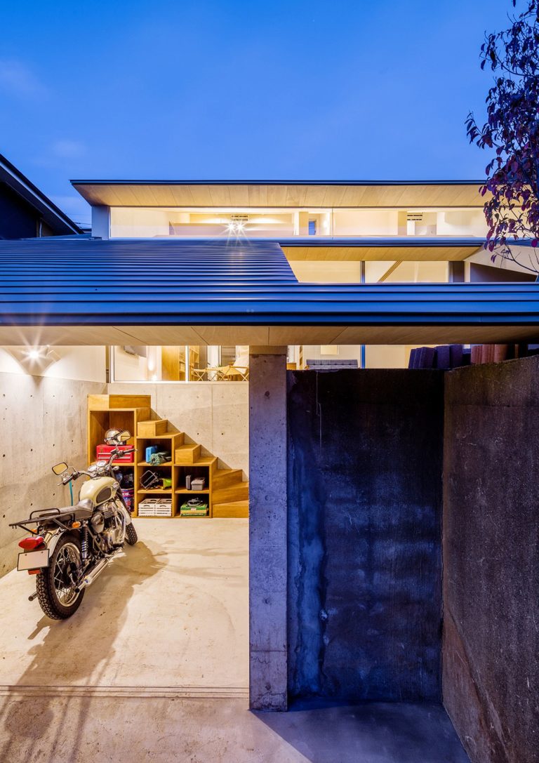 Chic Japanese House Integrates Old Retaining Wall With Woodsy Slanted ...